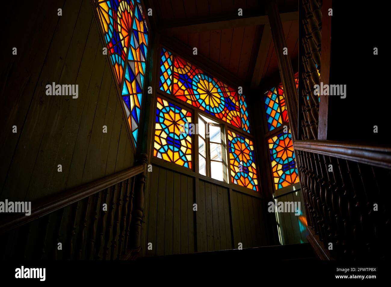 Authentic balcony of an old residential building with a stained glass ...