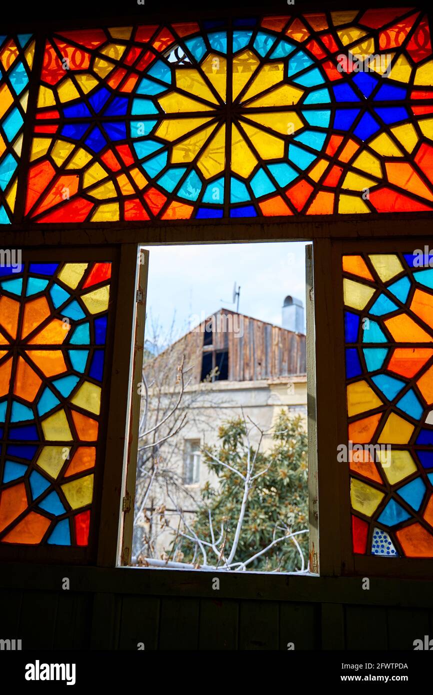 Authentic balcony of an old residential building with a stained glass ...