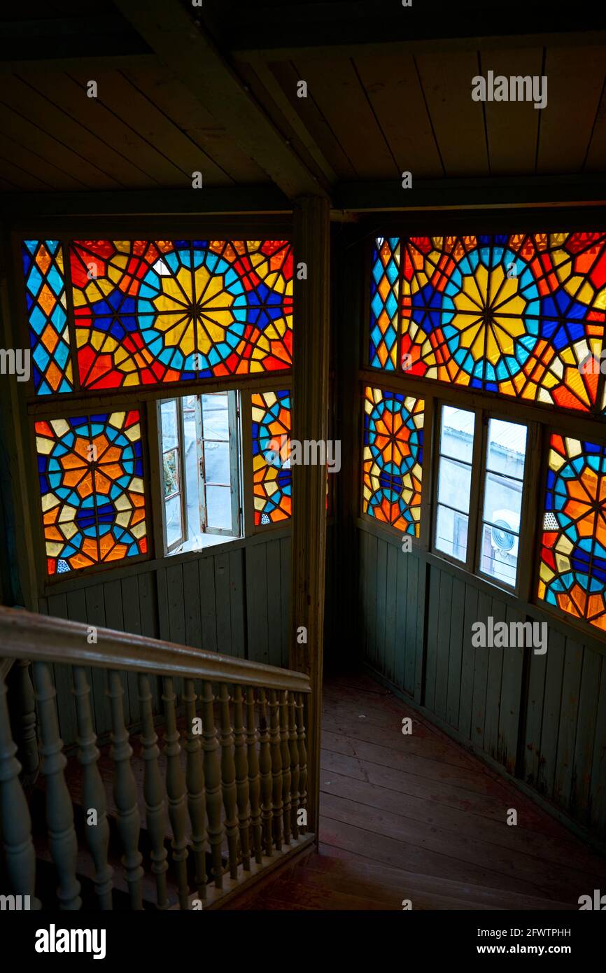 Authentic balcony of an old residential building with a stained glass ...