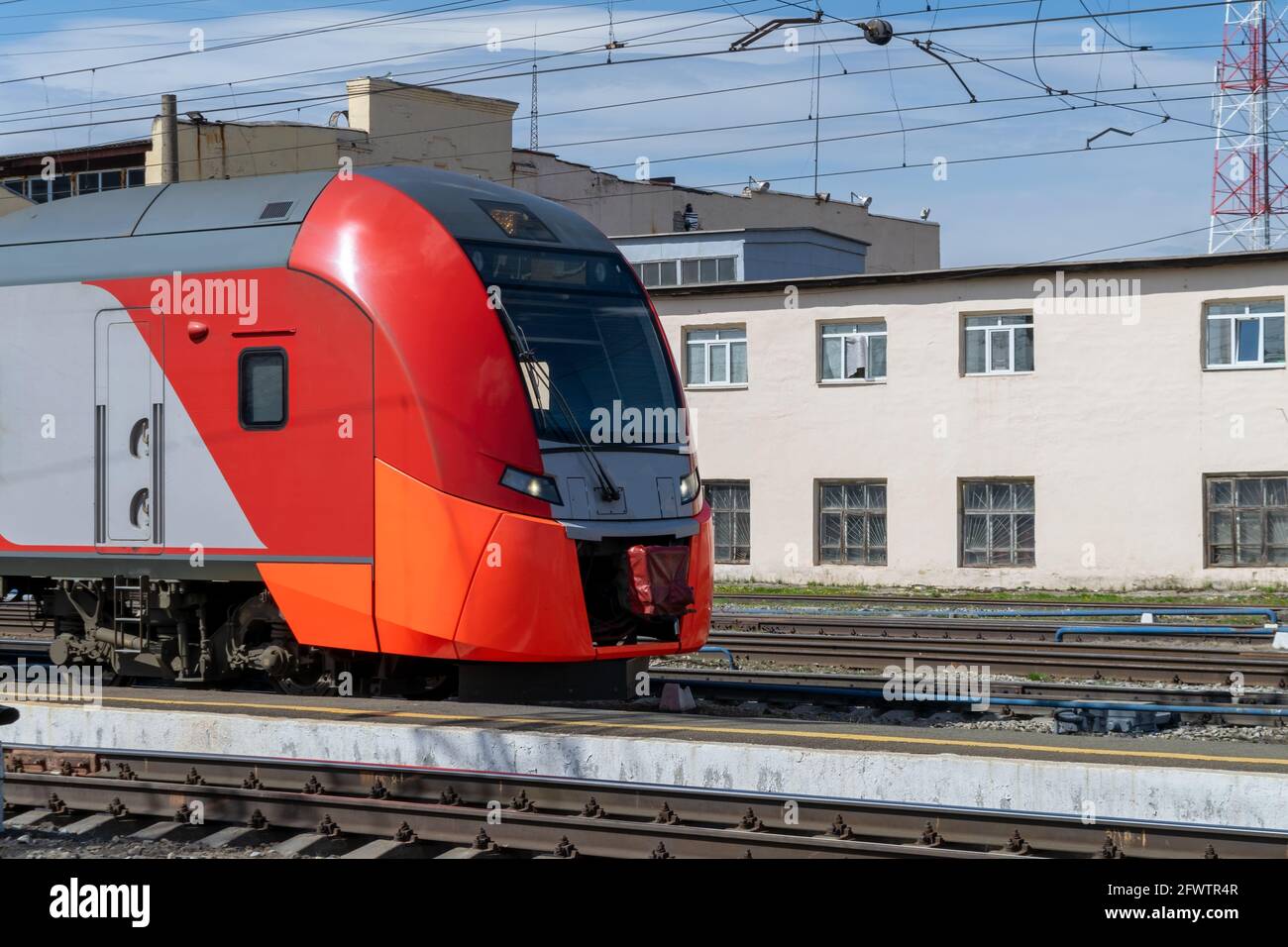 High-speed passenger electric train on the platform. High-speed train ...