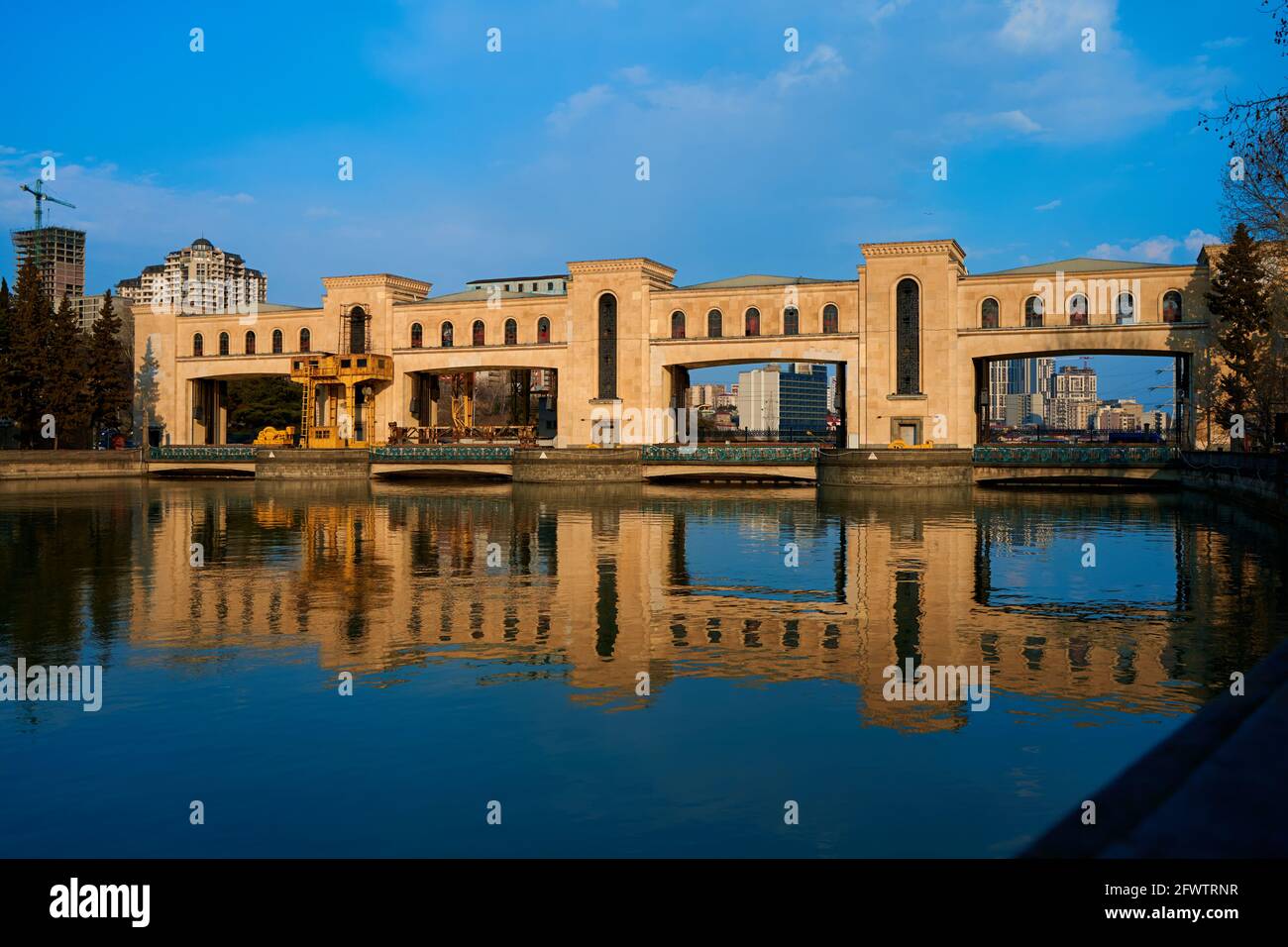 Bridge with sluice gate on the river. Old industry architecture Stock ...