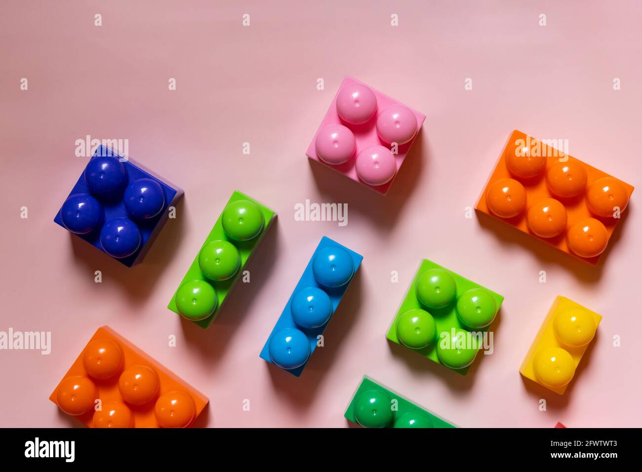 Colorful plastic construction blocks on white background as kids toys ...