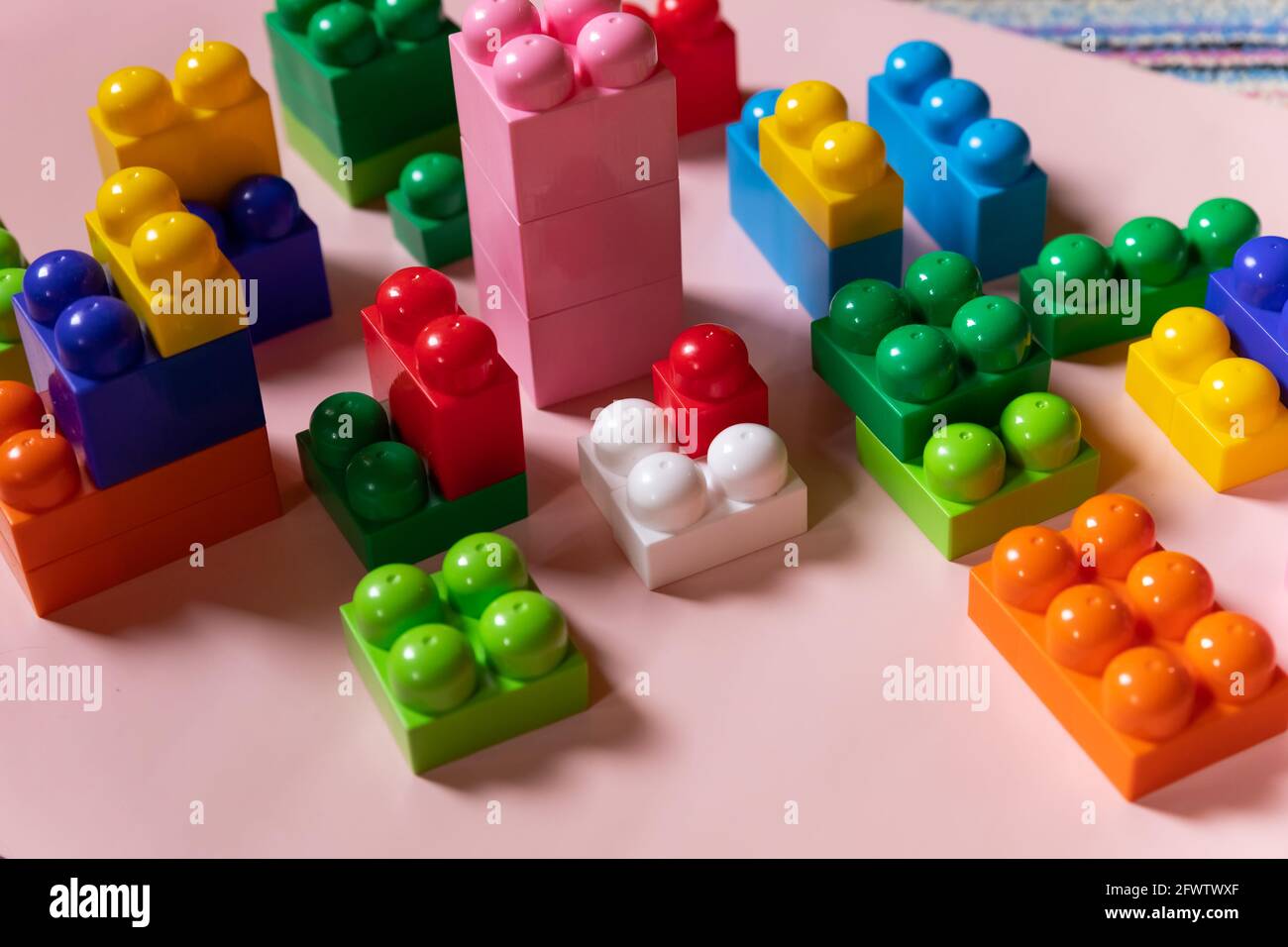 Colorful plastic construction blocks on white background as kids toys ...