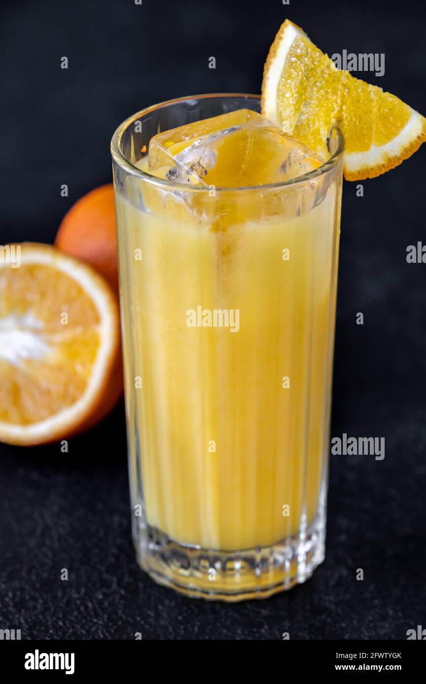 Screwdriver cocktail with orange juice and vodka on black background ...