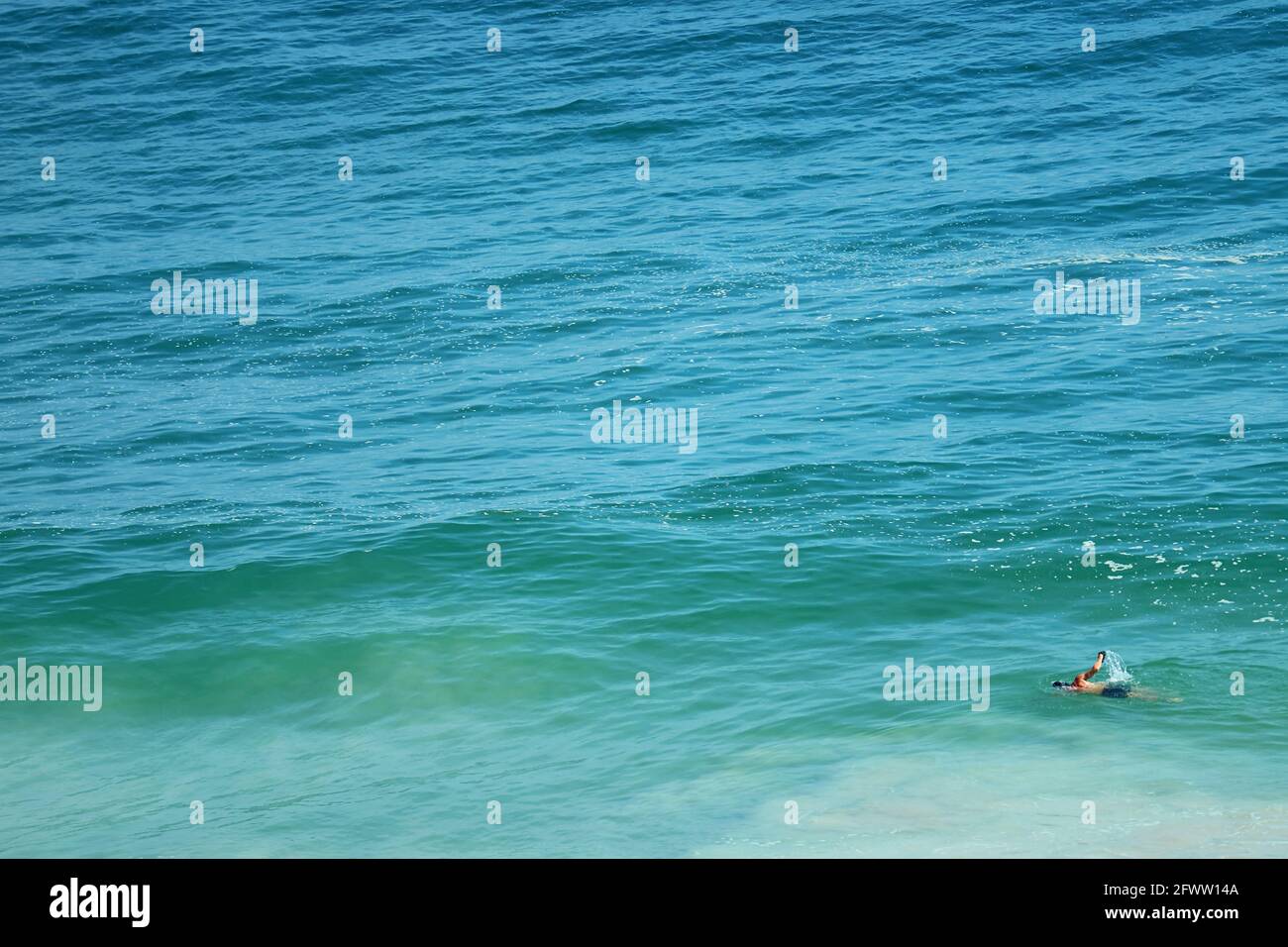 Aerial one man swimming sea hi-res stock photography and images - Alamy