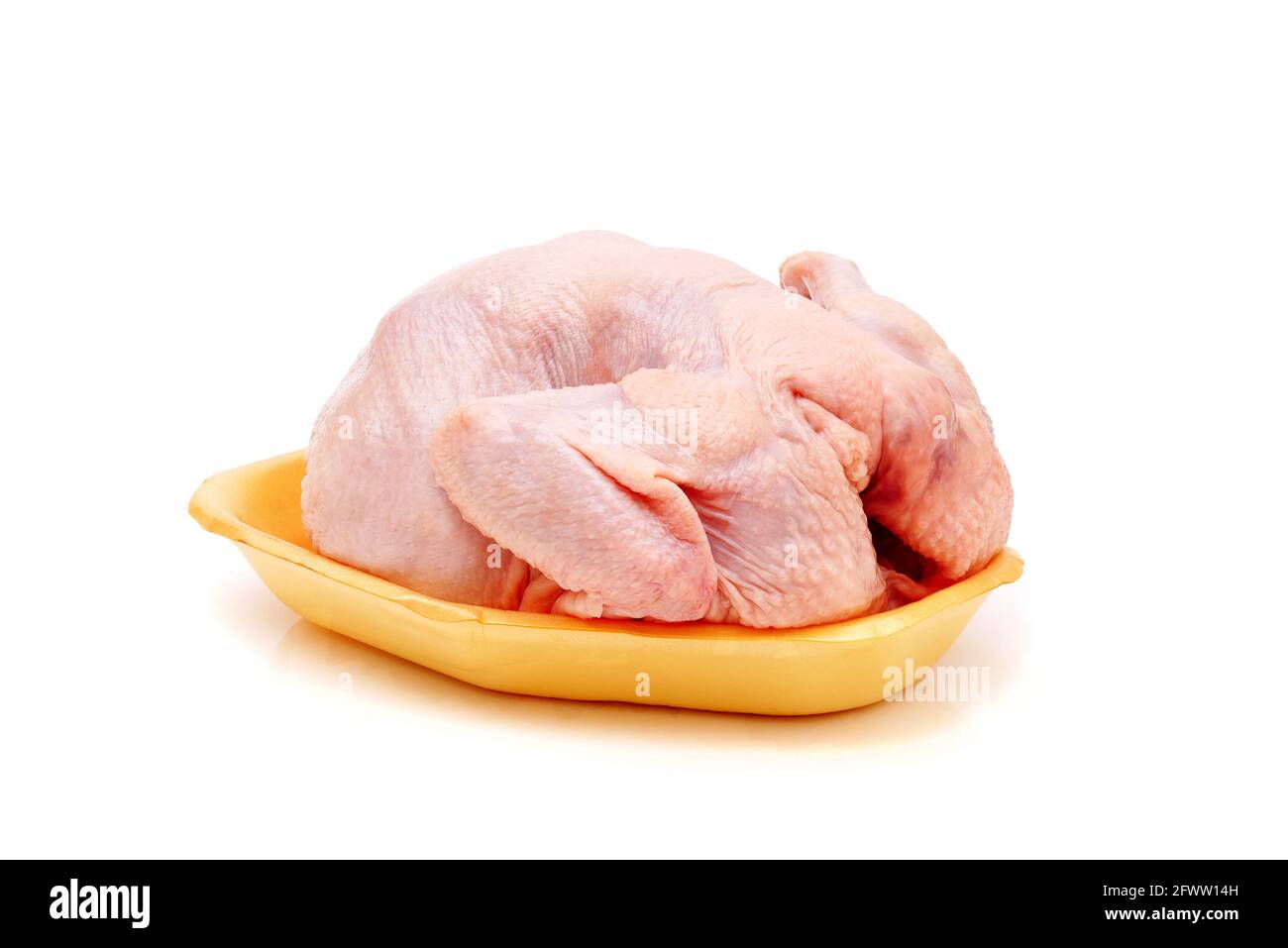 whole raw chicken carcass in plastic tray isolated on white background ...