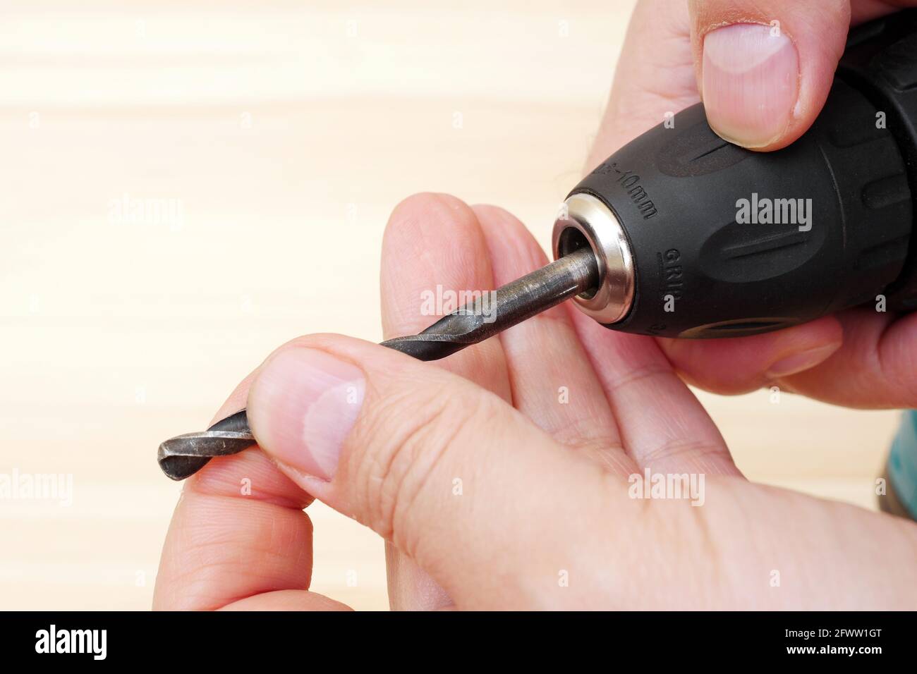 closeup of changing drill bit on drill machine Stock Photo - Alamy