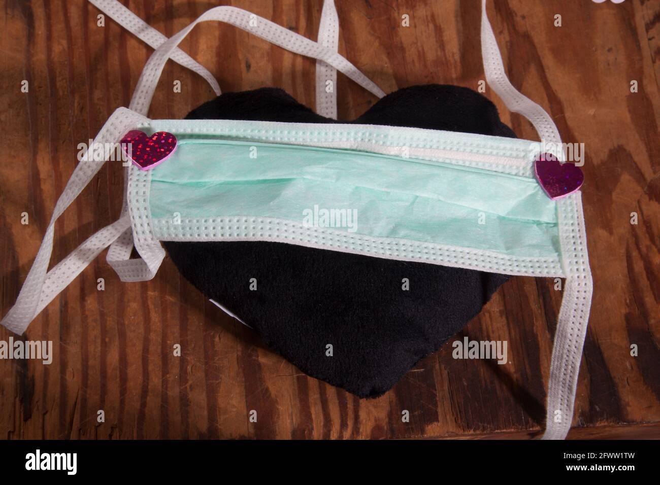Surgical mask and black heart Stock Photo - Alamy