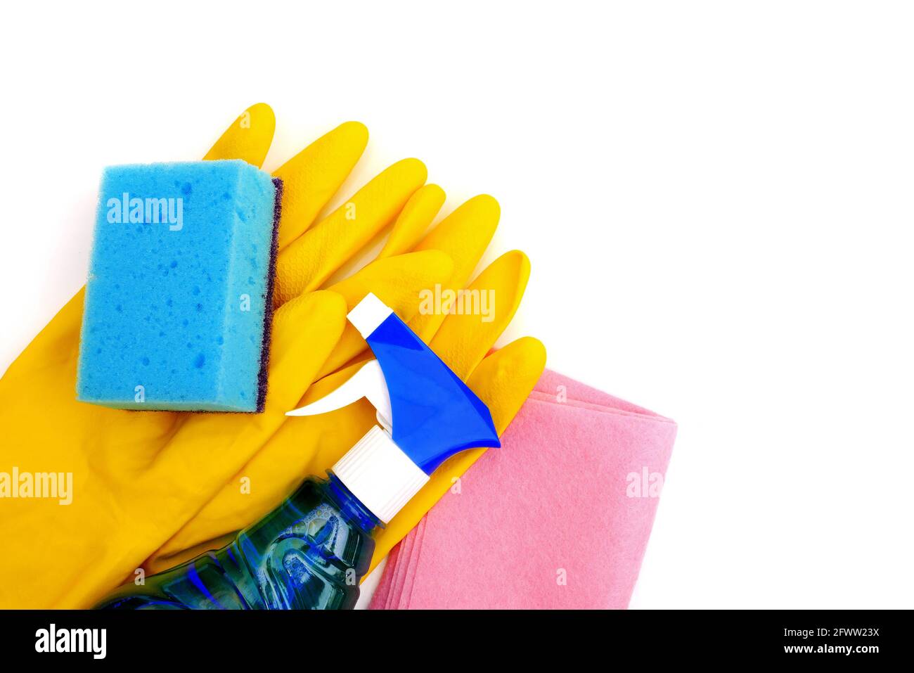 top view on cyan kitchen sponge, yellow household gloves, bottle of ...