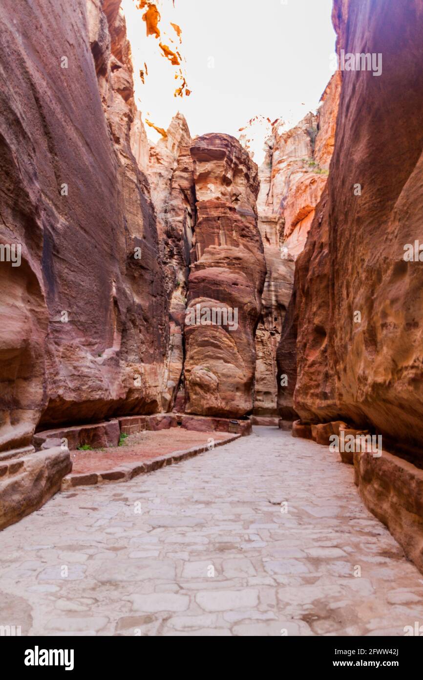The Siq, narrow gorge, main entrance to the ancient city Petra, Jordan ...