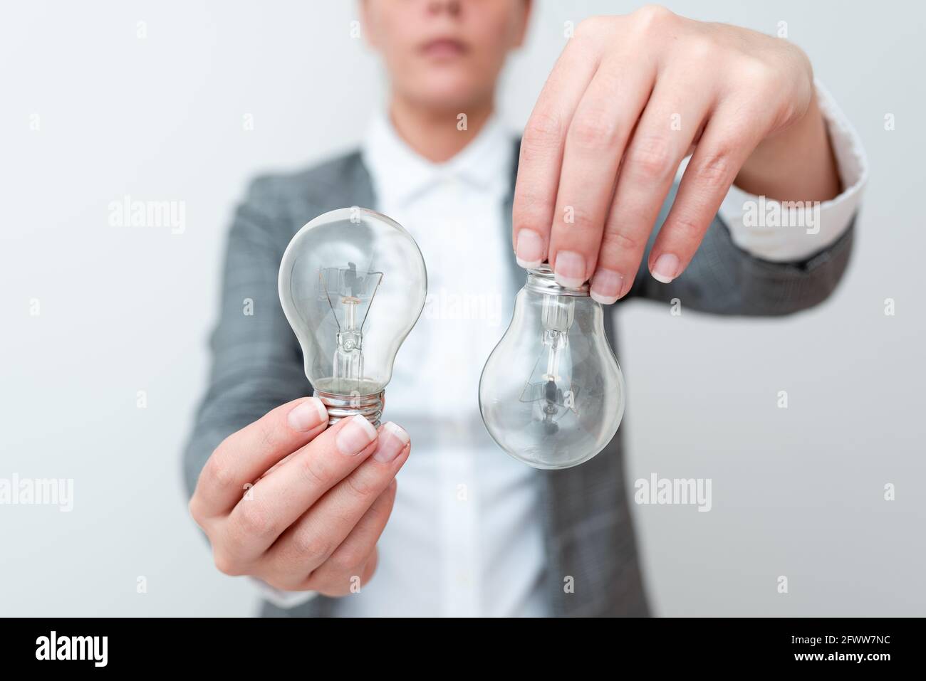 Lady Holding Two Lamps Upside Down With Outfit Proposing New Ideas For ...