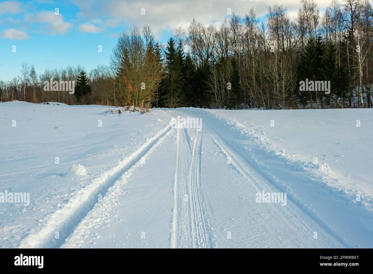 tourist trail in winter snow with boot tracks and steps Stock Photo - Alamy
