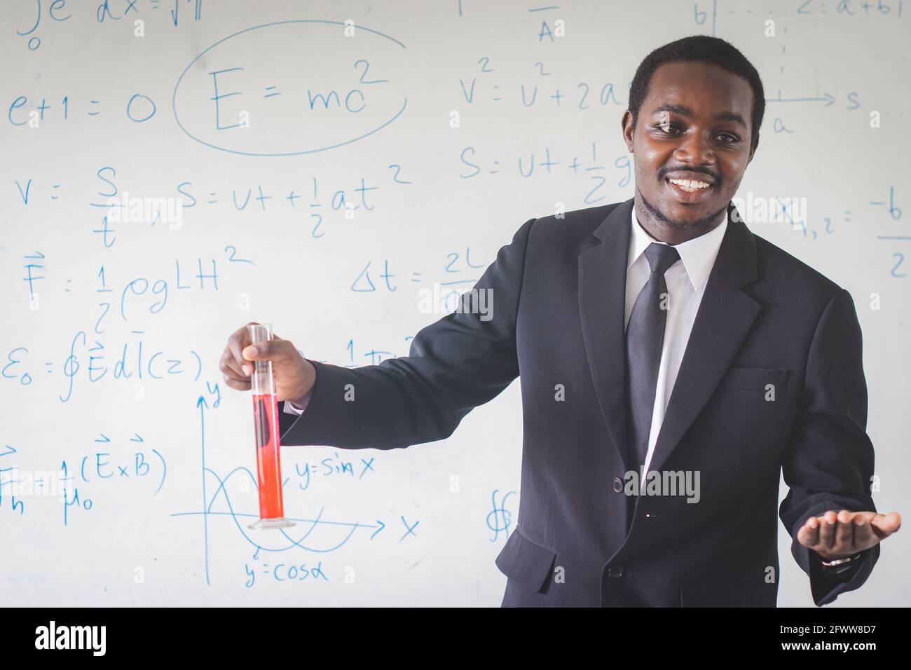 African teacher is explaining science lessons inside the classroom with ...