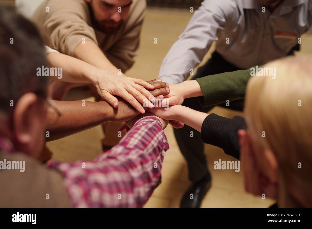 Pile of hands made up of several people of various ethnicities as ...