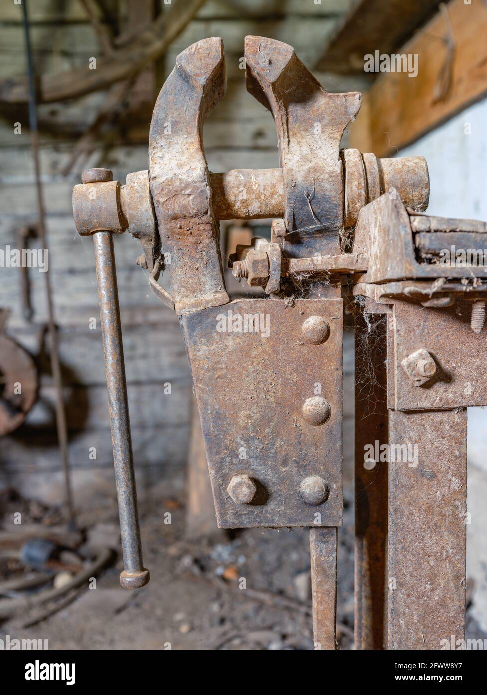 old workshop smith details with rusty tools and stone walls covered in ...