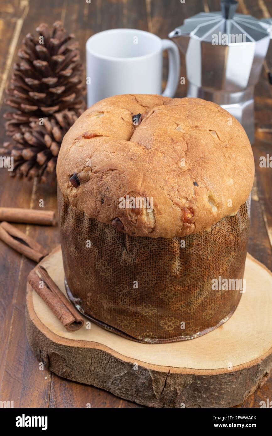 Traditional italian christmas fruit cake panettone over wooden board ...