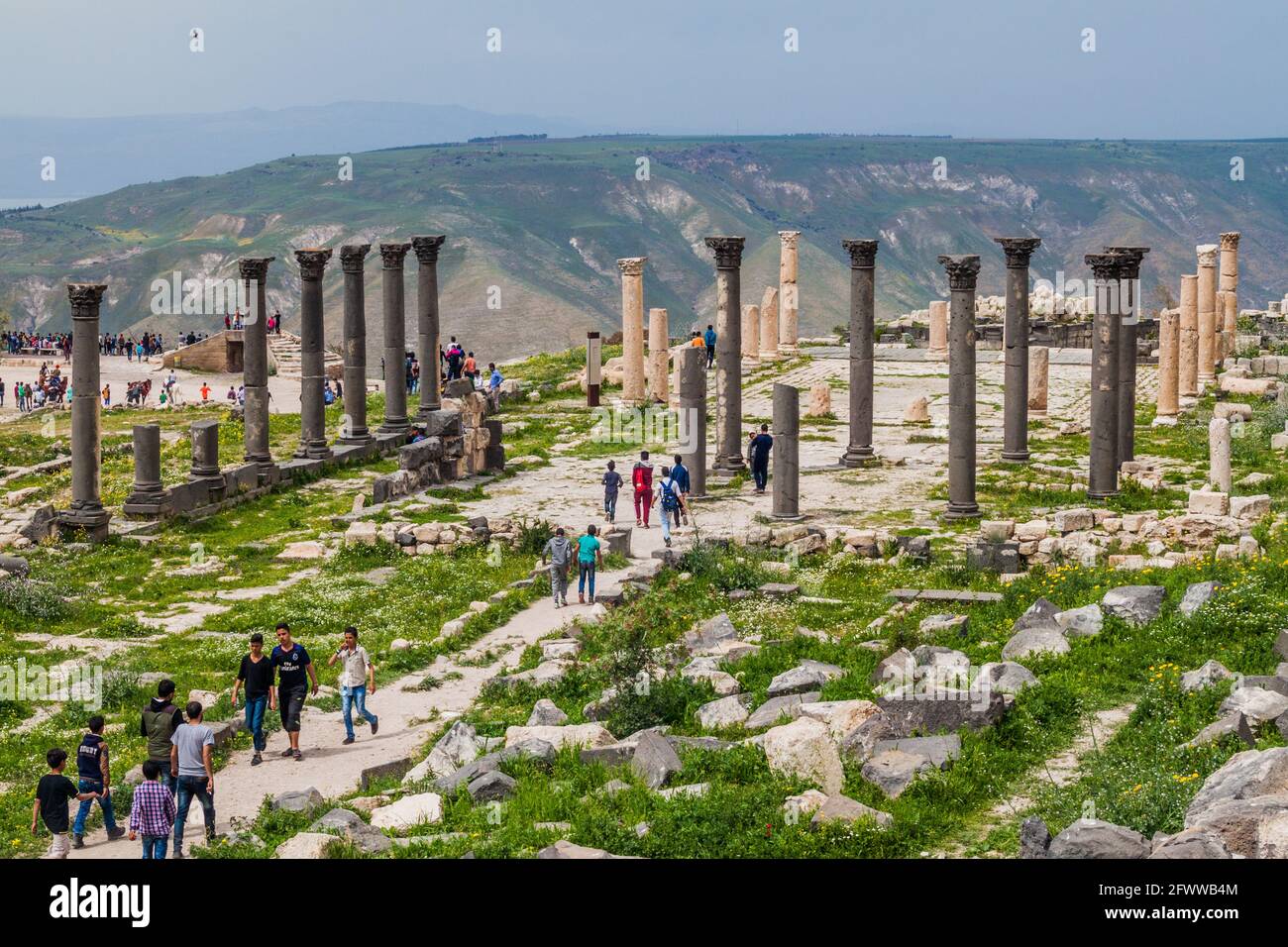 UMM QAIS, JORDAN - MARCH 30, 2017: Tourists visit the Basilica Terrace ...