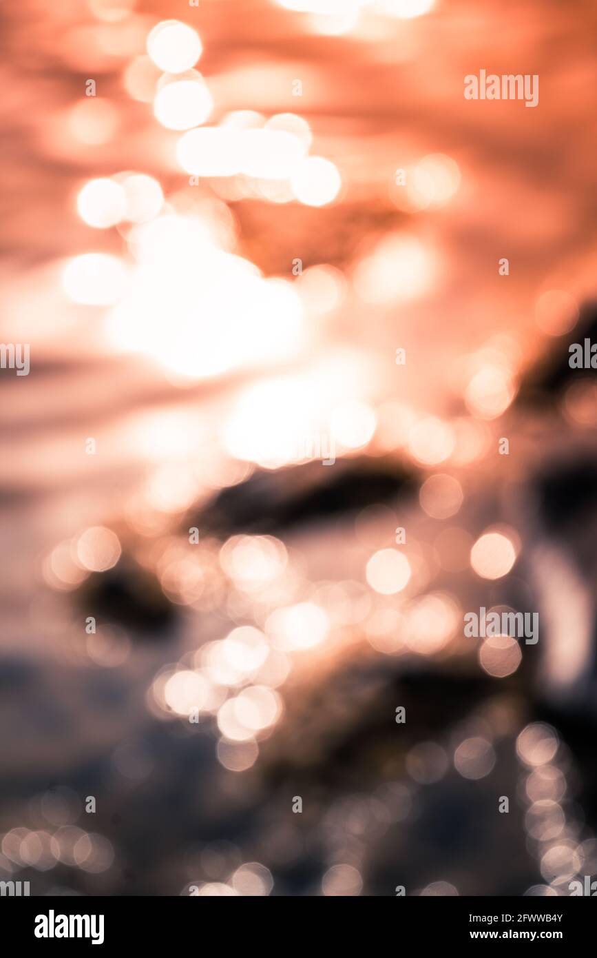 Bokeh shapes and shadows on water surfaces on the coast creating ...