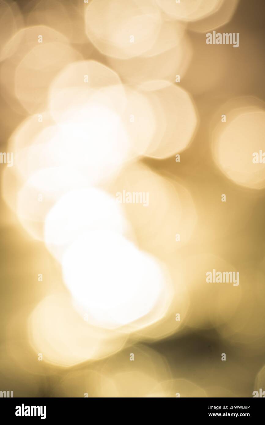 Bokeh shapes and shadows on water surfaces on the coast creating ...