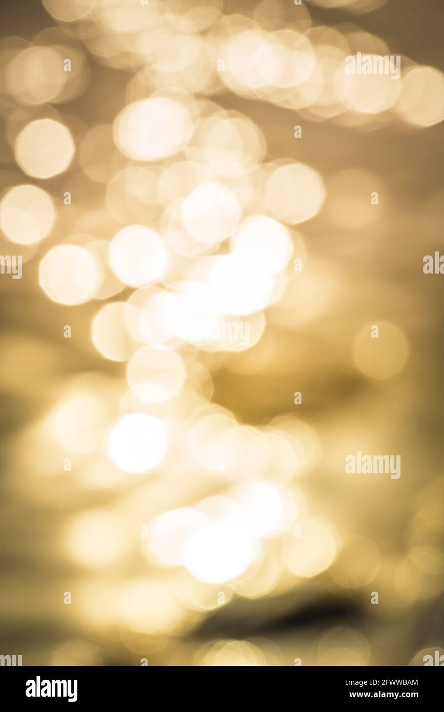 Bokeh shapes and shadows on water surfaces on the coast creating ...