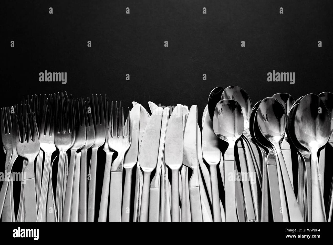 Basic and simple stainless steel cutlery consisting of knives, spoons ...