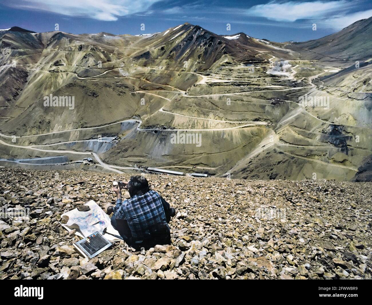 El Indio; Chile. A geologist makes field observations from a vantage ...
