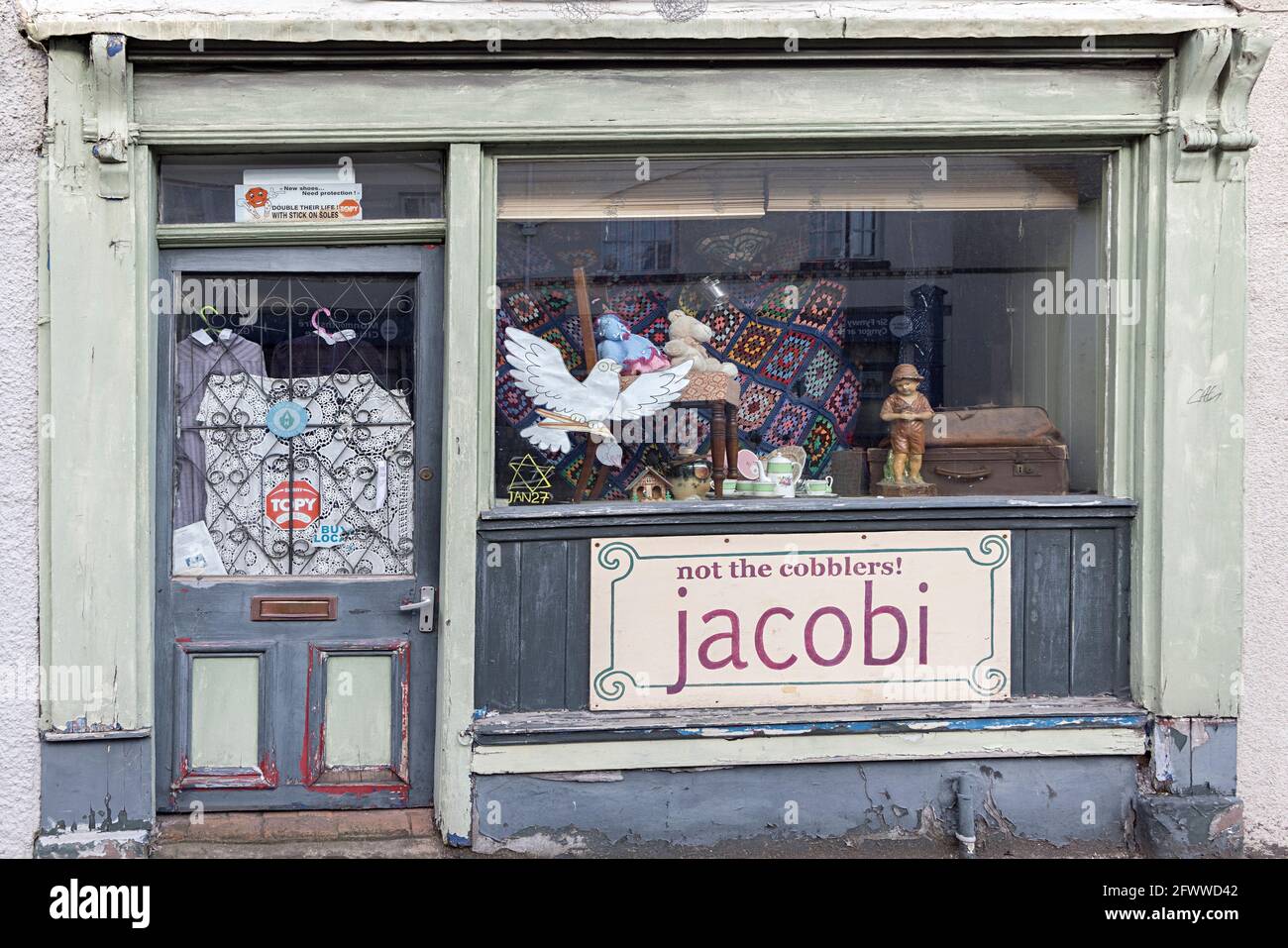 Shop front with window and faded paintwork, Abergavenny, Wales, UK ...