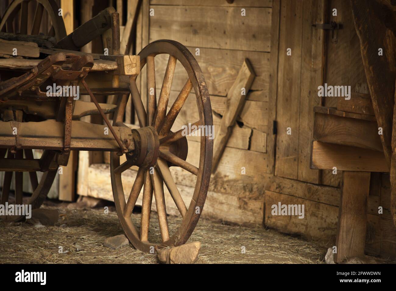 Old wooden wagon in a barn Stock Photo - Alamy