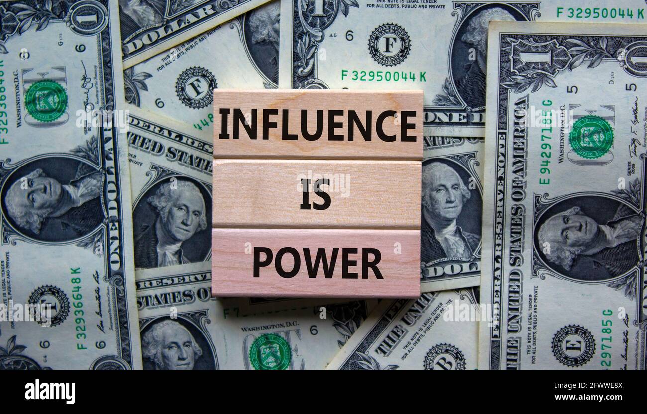 Influence is power symbol. Wooden blocks with words 'Influence is power ...
