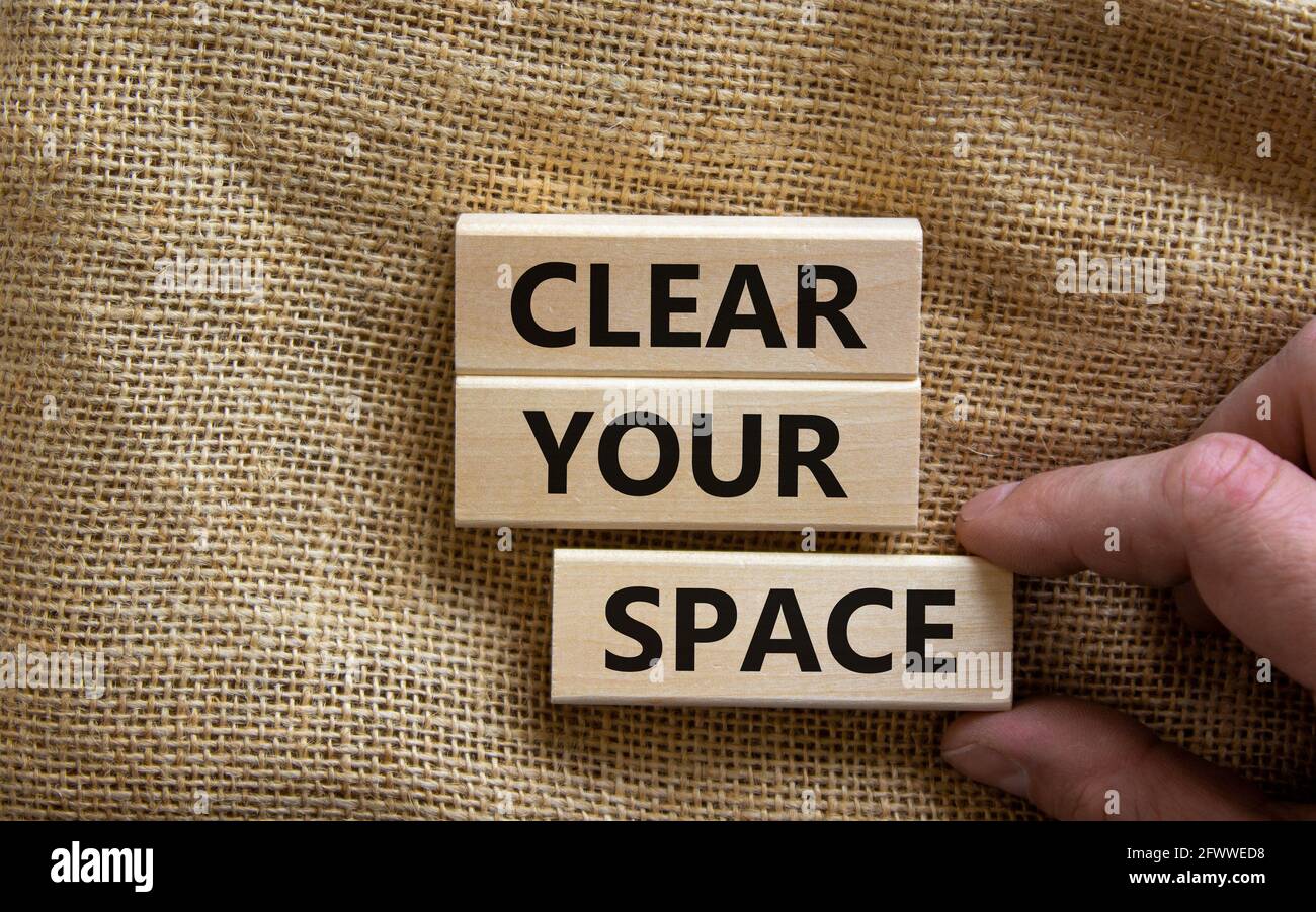 Clear your space symbol. Wooden blocks with words 'Clear your space ...