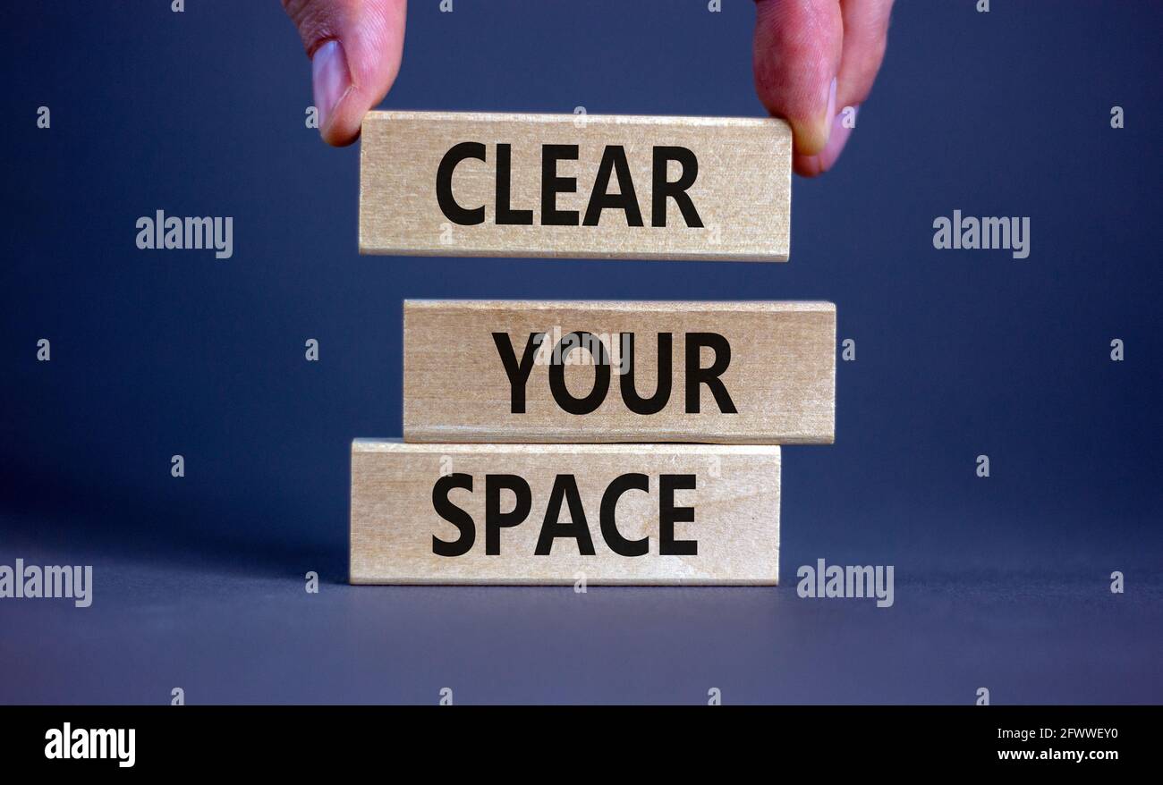 Clear your space symbol. Wooden blocks with words 'Clear your space ...