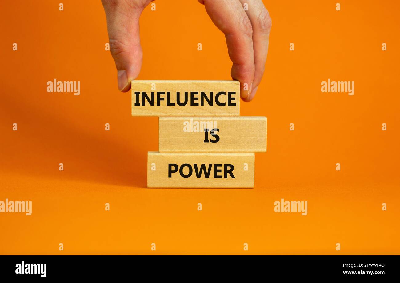 Influence is power symbol. Wooden blocks with words 'Influence is power ...
