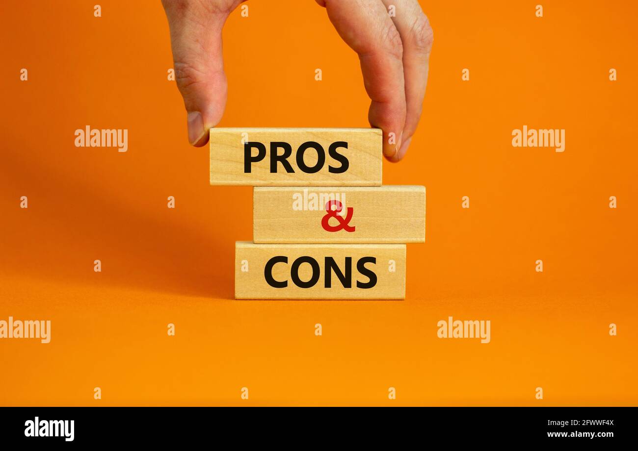 Pros and cons symbol. Wooden blocks with words 'Pros and cons ...