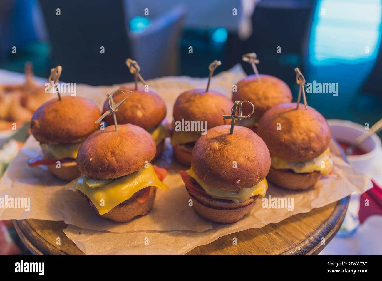 Small burgers served on one plate as appetizers Stock Photo - Alamy