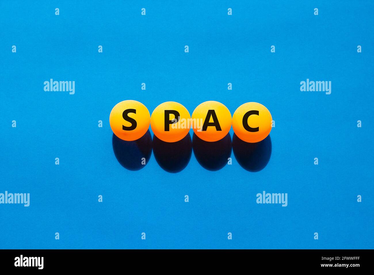 SPAC, special purpose acquisition company symbol. Orange table tennis ...