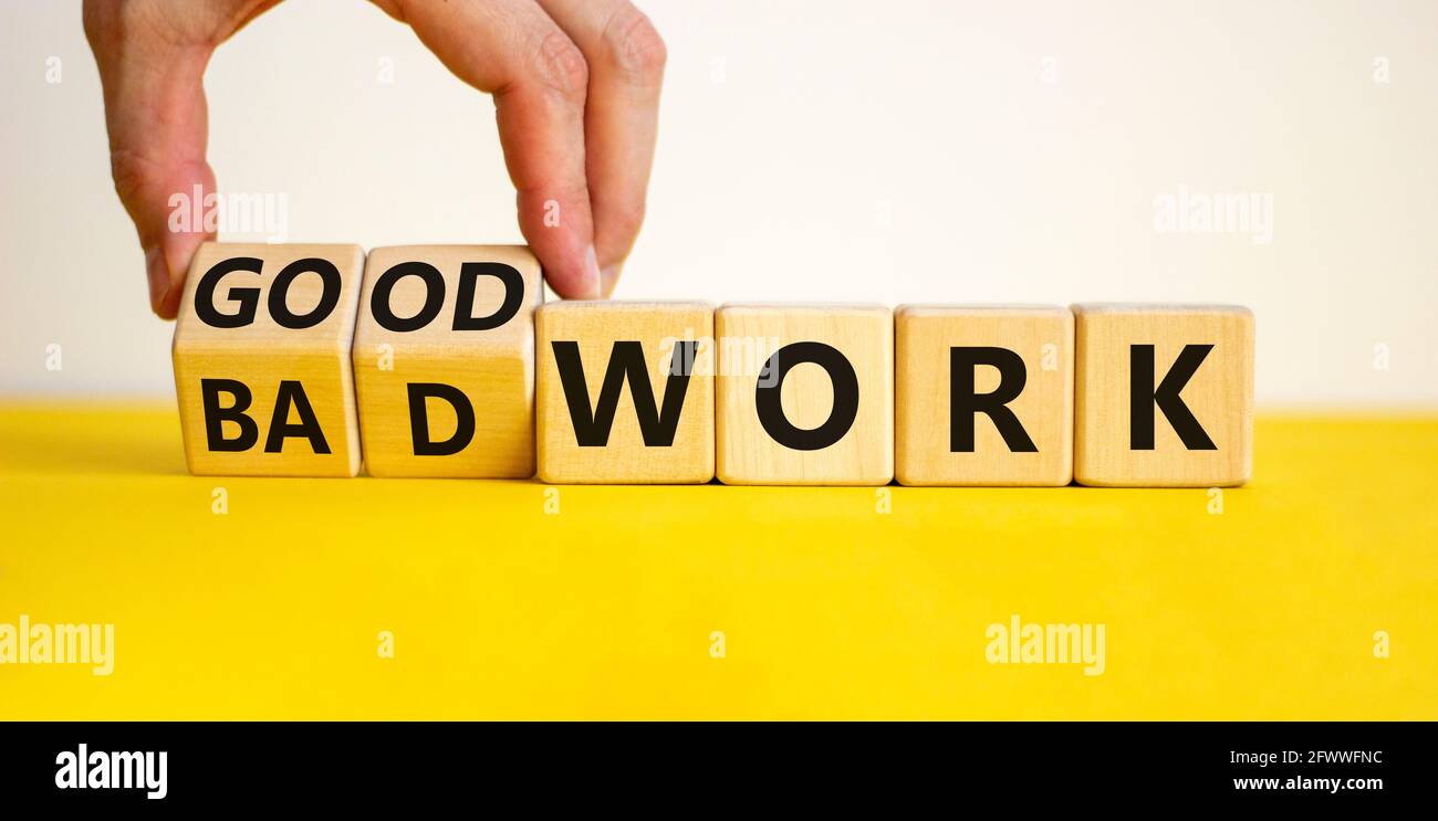 Good or bad work symbol. Businessman turns wooden cubes and changes ...