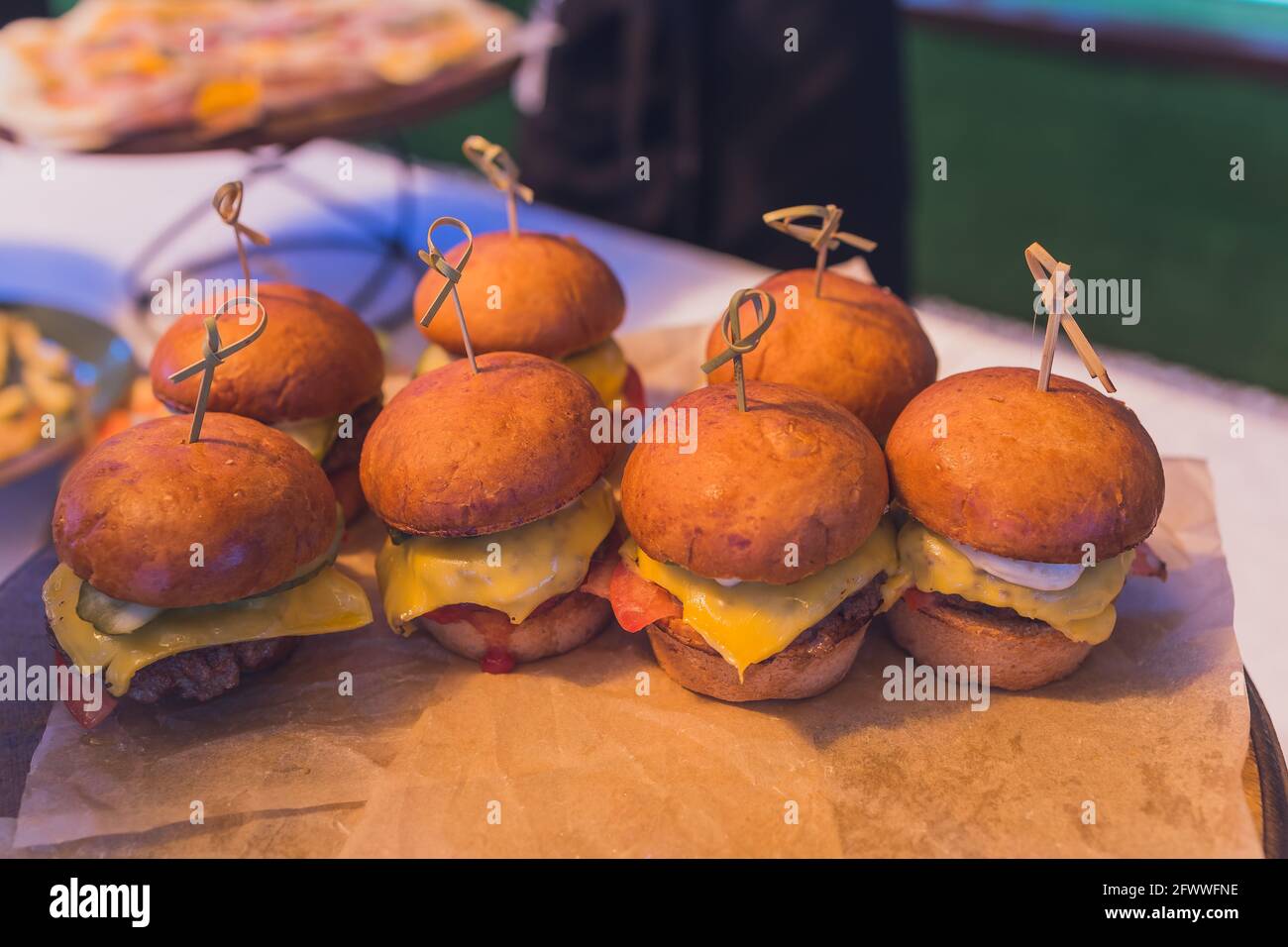 Small burgers served on one plate as appetizers Stock Photo - Alamy