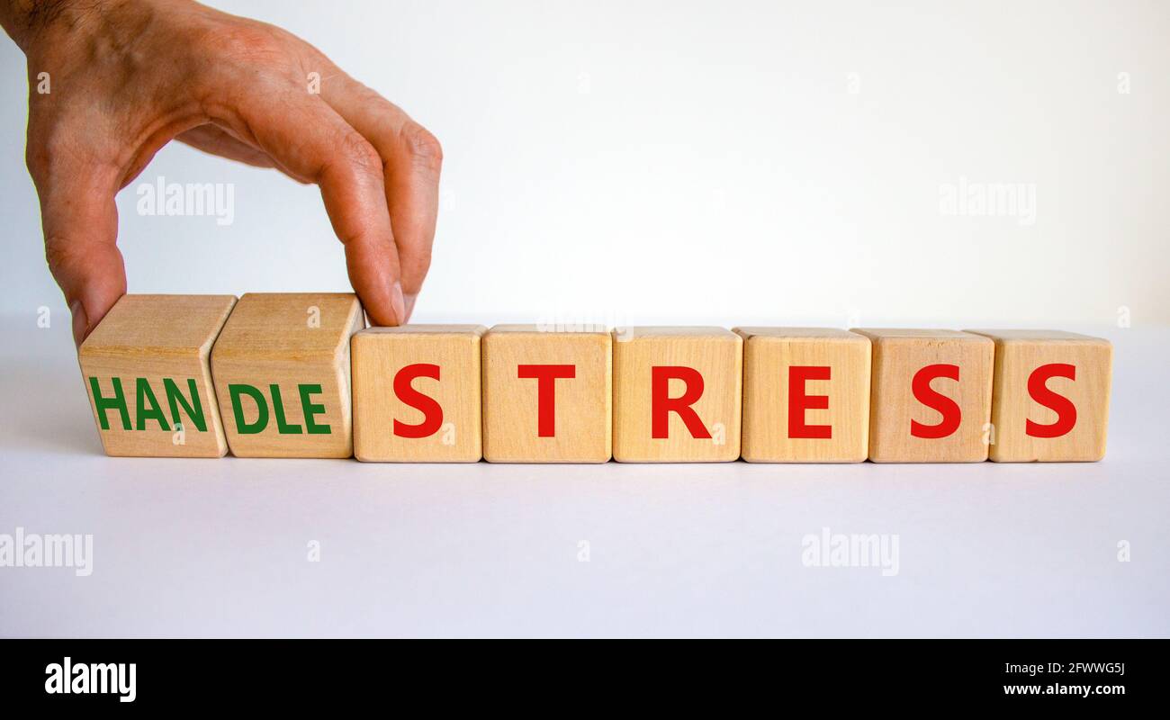 Handle stress symbol. Businessman turns cubes and changes words 'stress ...