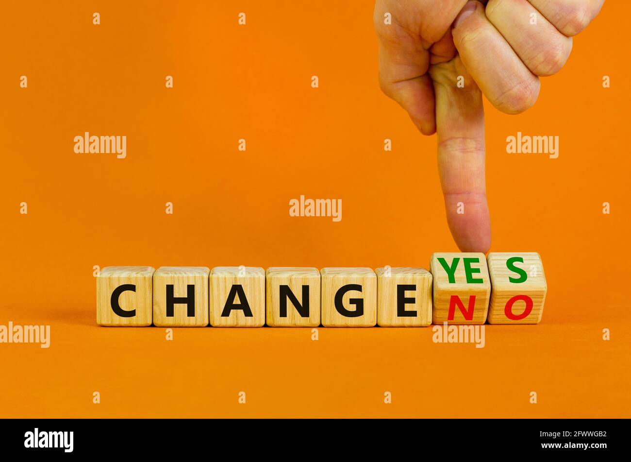 Change yes or no symbol. Businessman turns cubes and changes words ...