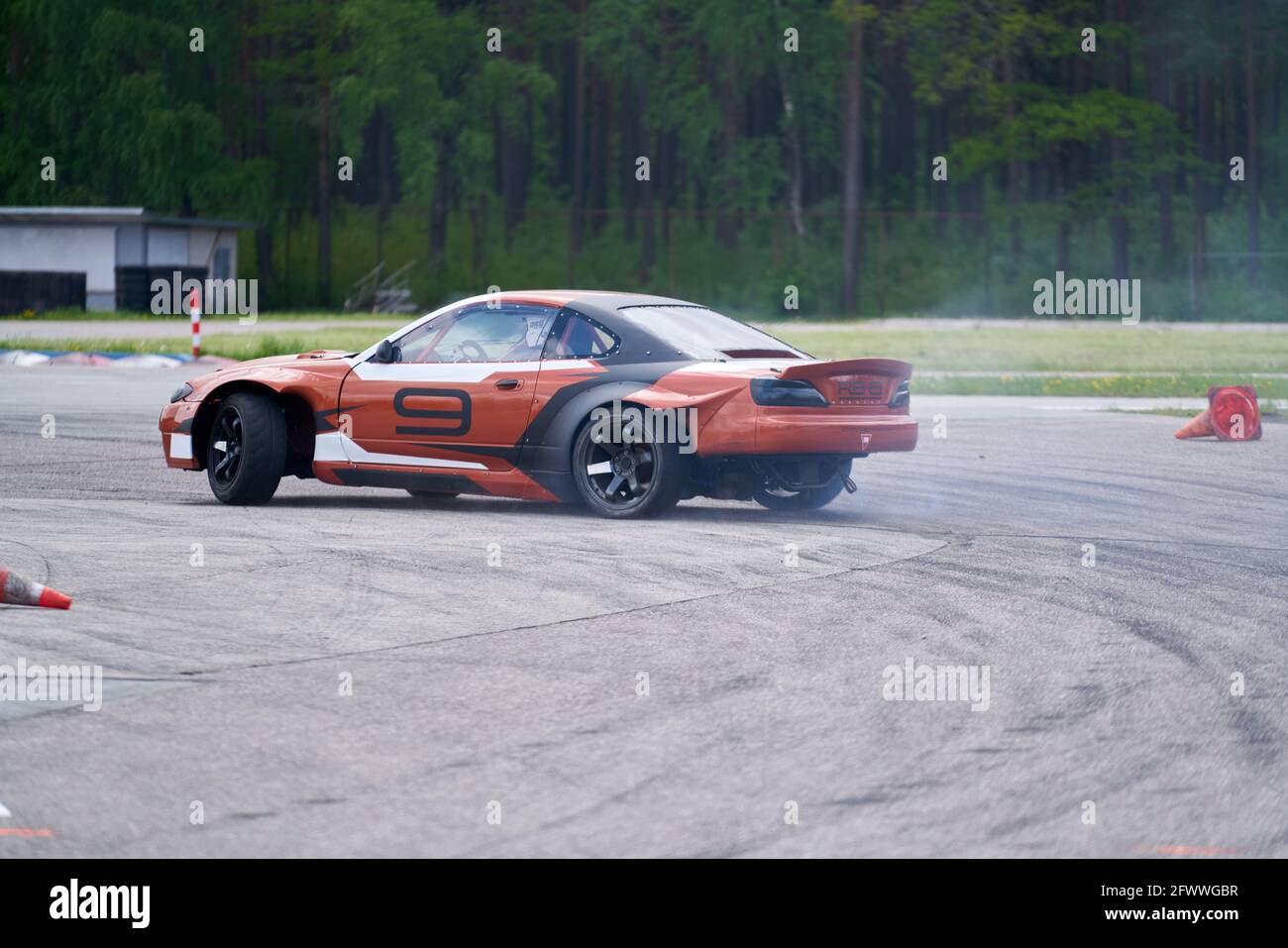 21-05-2021 Riga, Latvia car drifting on asphalt racing track with lot ...
