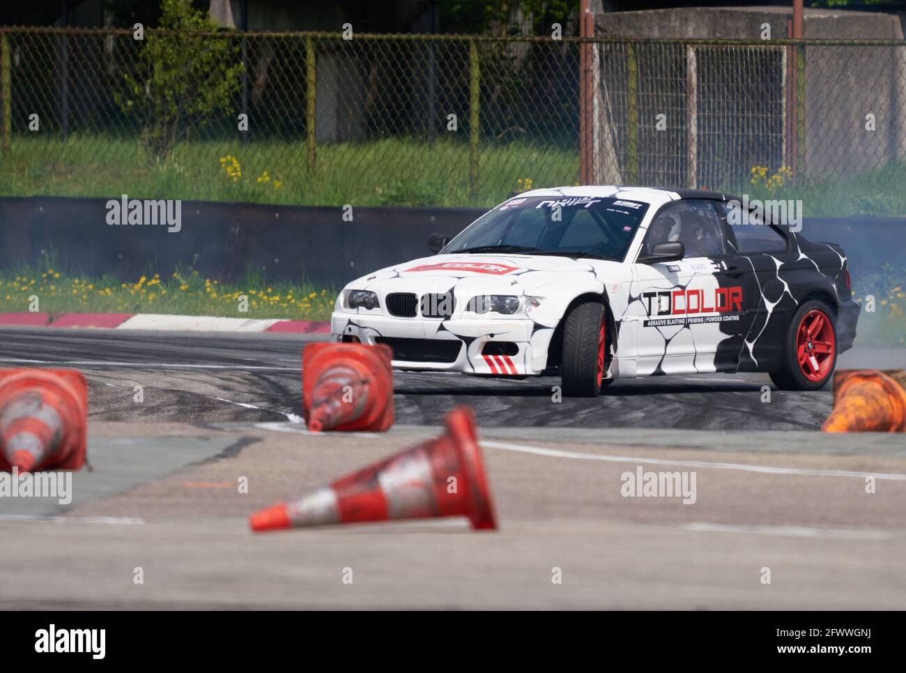 21-05-2021 Riga, Latvia car drifting on asphalt racing track with lot ...