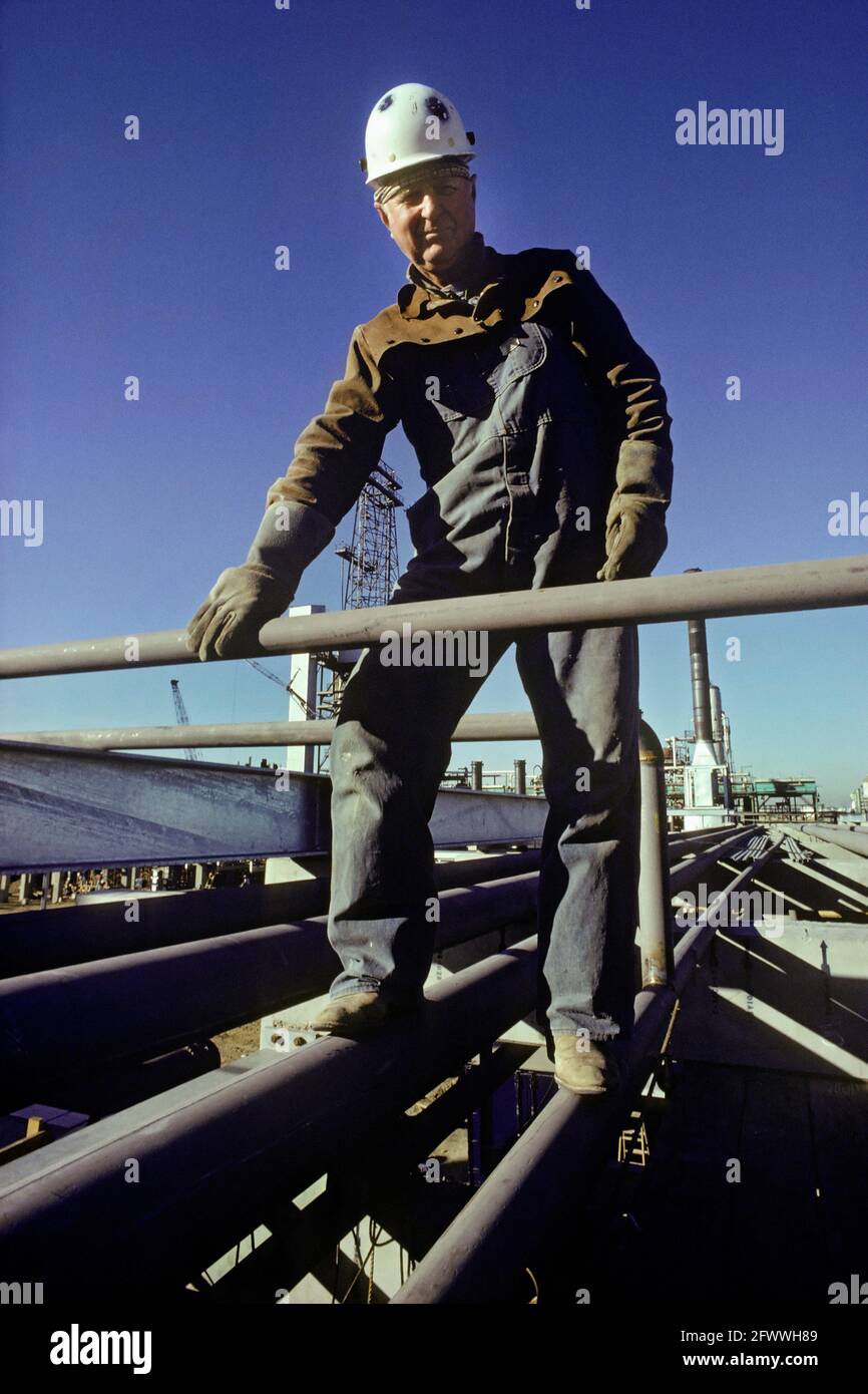 A welder/pipe fitter at a petrochemical plant construction Stock Photo ...