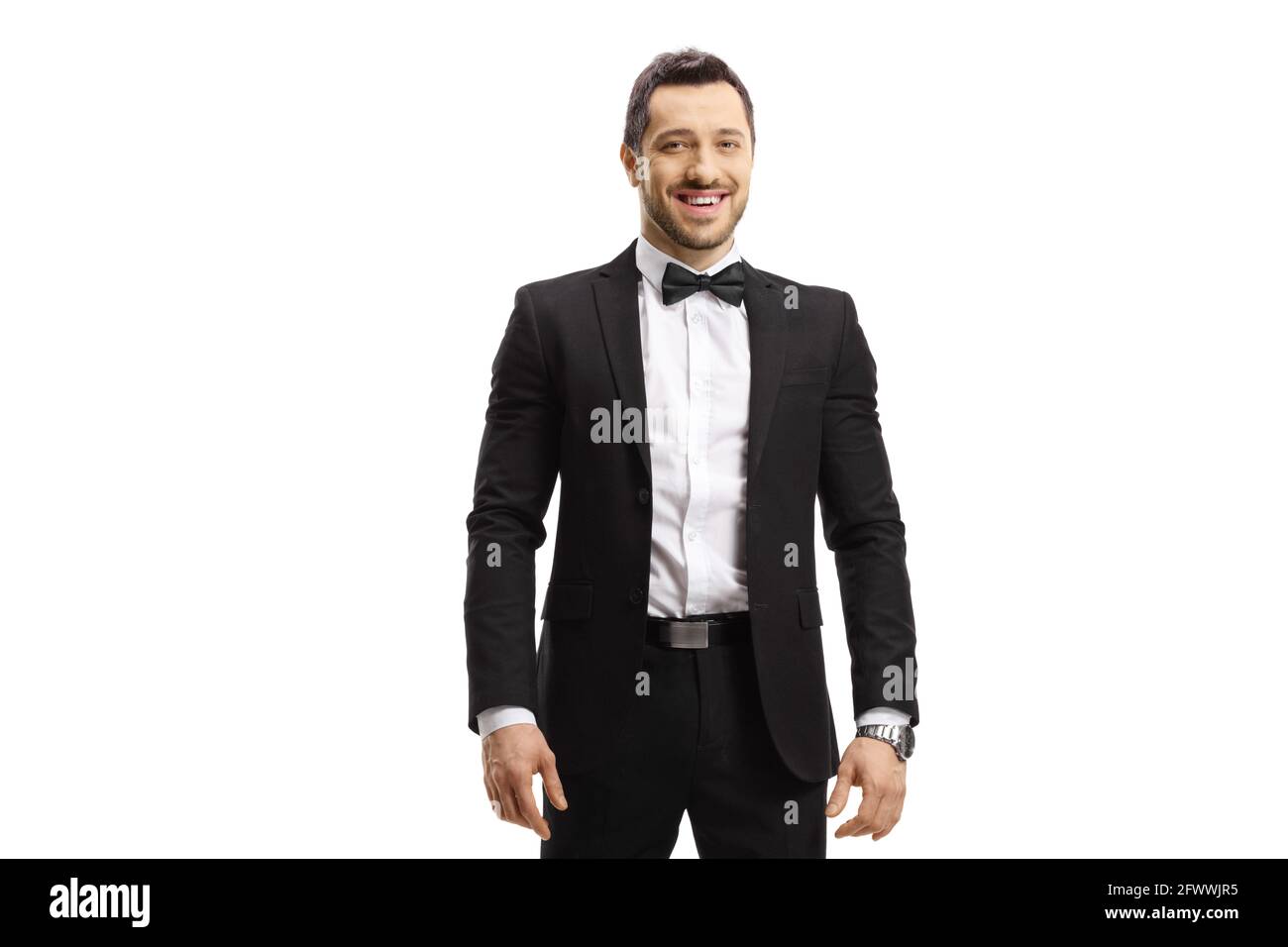 Man in a suit and bow tie smiling at the camera isolated on white ...