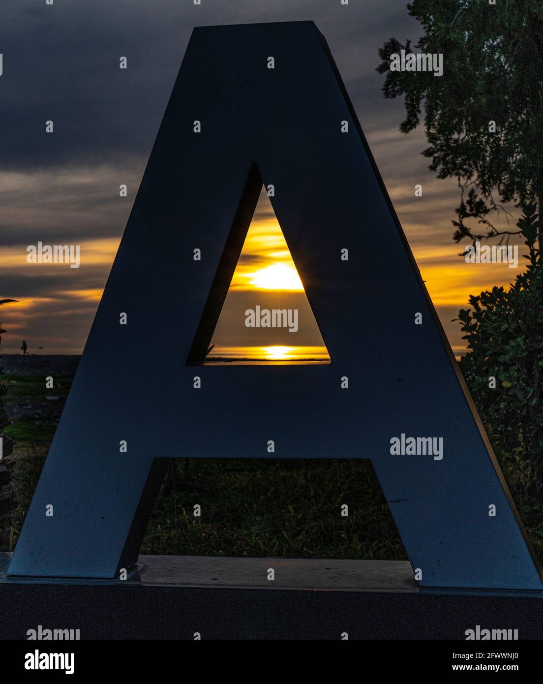 White letters on a yellow sunset background Stock Photo - Alamy