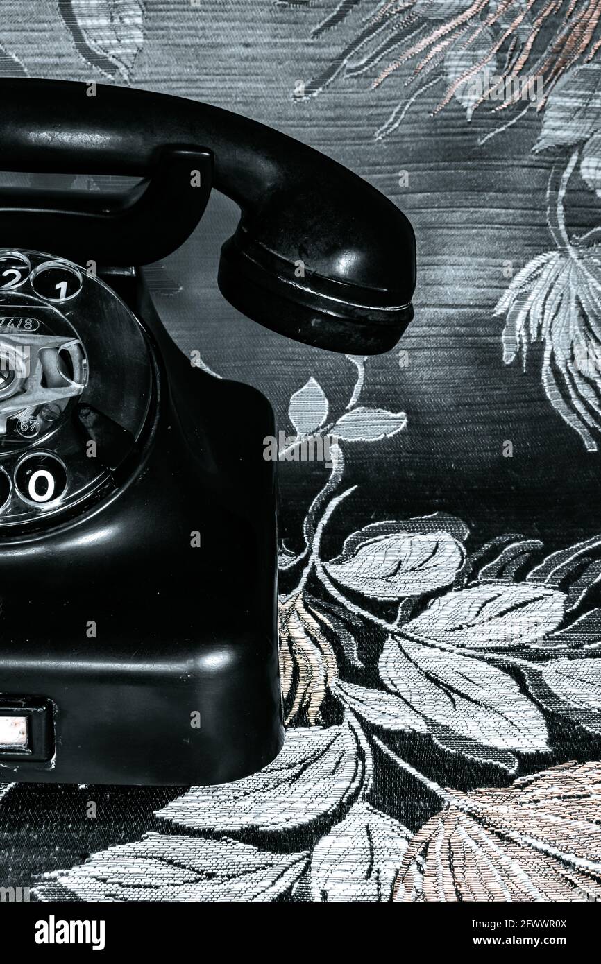 close-up of old black vintage telephone on flowery background Stock ...