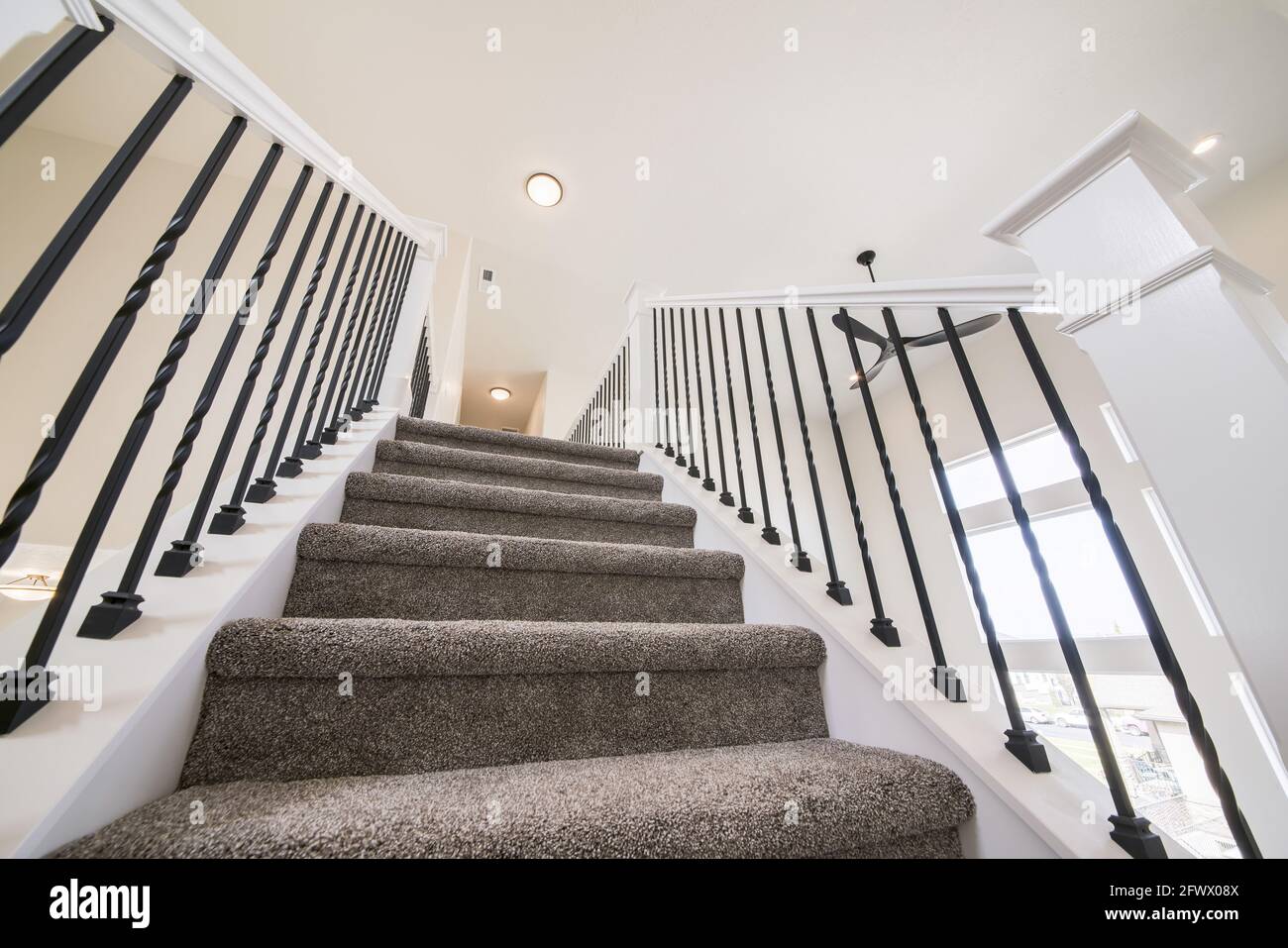 Low angle of minimalistic interior design of white stairs Stock Photo ...