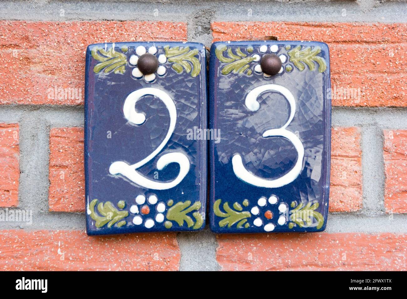 Number 23 in white on blue ceramic plates Stock Photo - Alamy