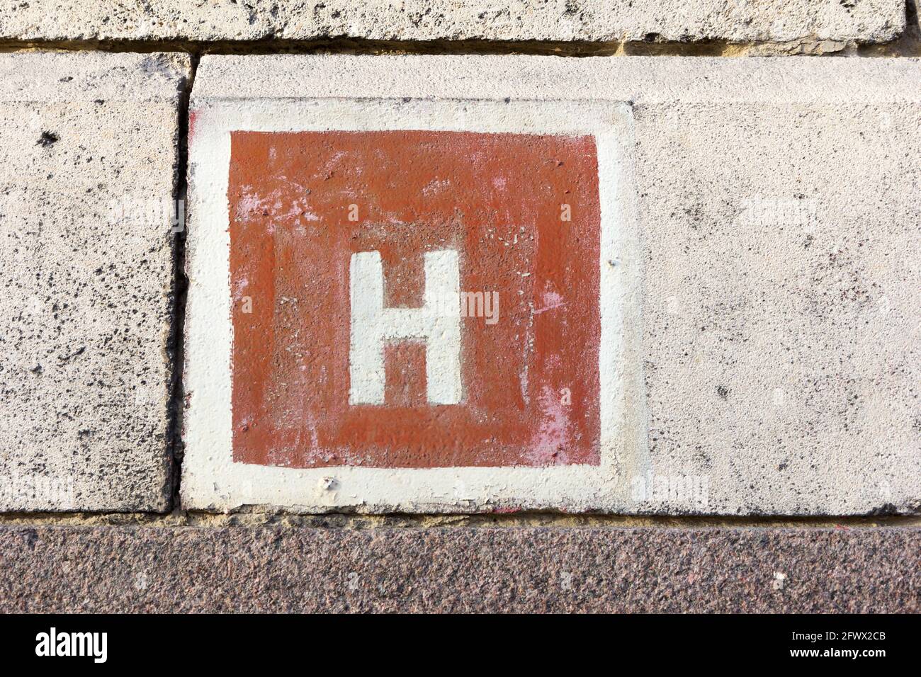 a brick with the letter H for Hospital Stock Photo - Alamy