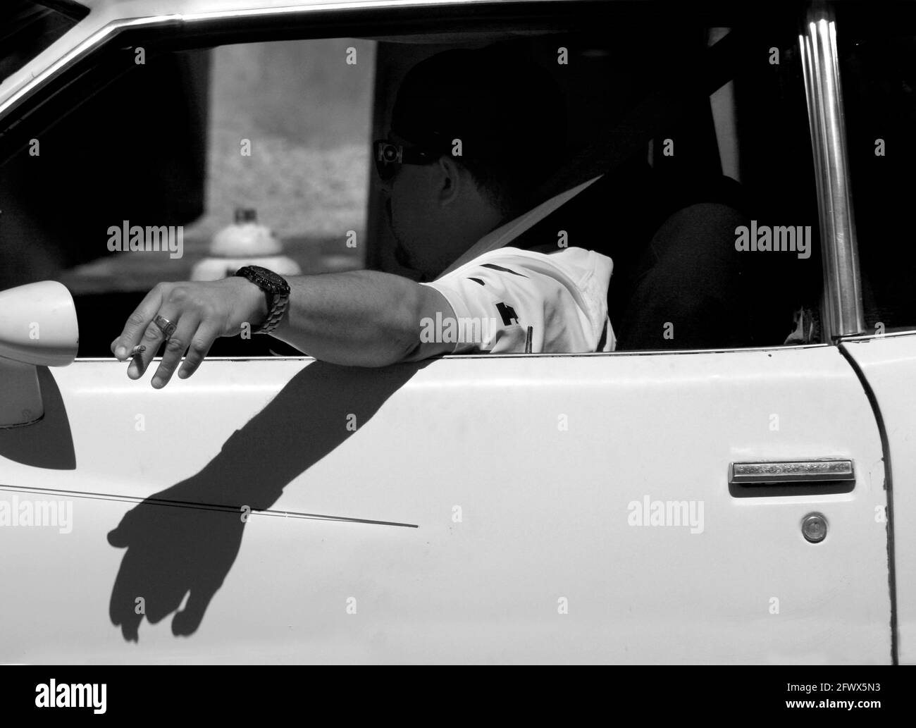 A young hispanic man slowly cruises through downtown Santa Fe, New ...