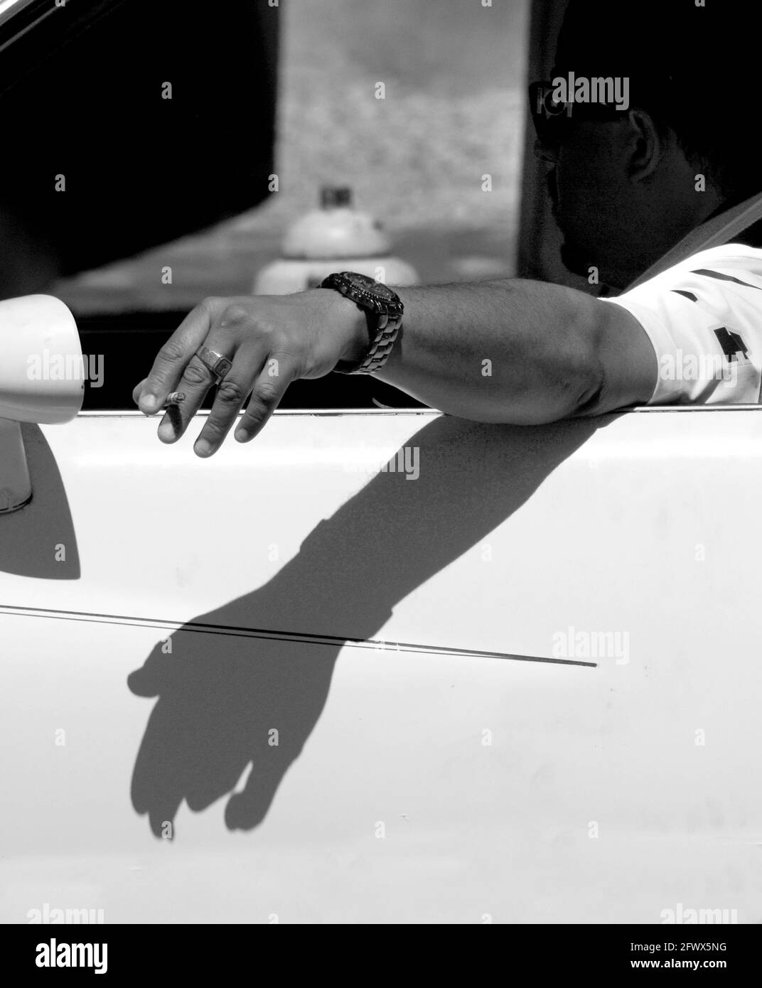 A young hispanic man slowly cruises through downtown Santa Fe, New ...